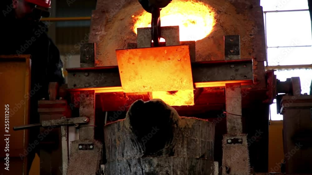 Cast iron smelting process shooting. Cast iron. Workers pour the melted ...