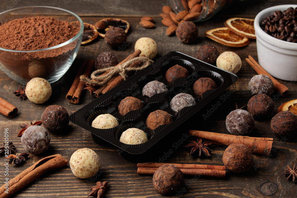 assorted chocolates. candy balls of different types of chocolate on a ...