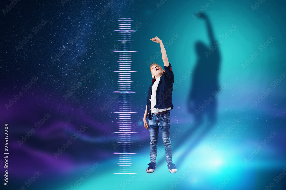 Creative background, Boy on a blue background shows how he grew up ...