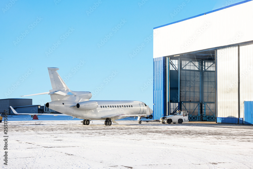 Aircraft is delivered inside the aircraft hangar for maintenance. Stock ...