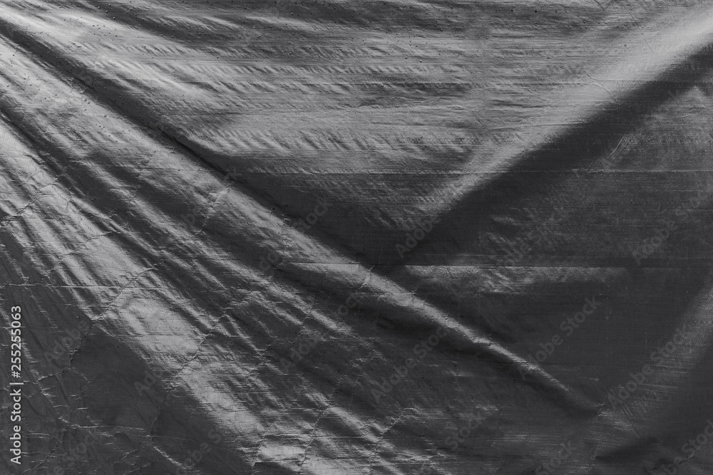 Full frame background of a wrinkled tarp texture in black and white ...