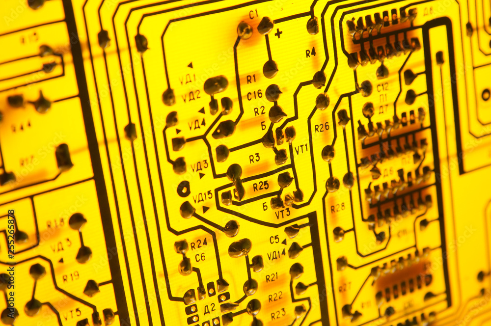 Yellow printed circuit board on the lighting. Soldering side of the PCB ...