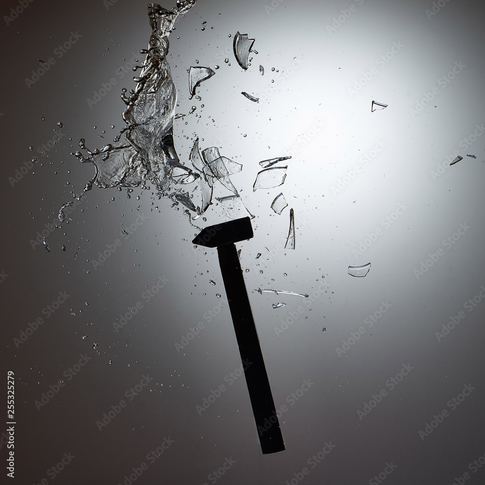 Hammer breaking champane glass Stock Photo | Adobe Stock