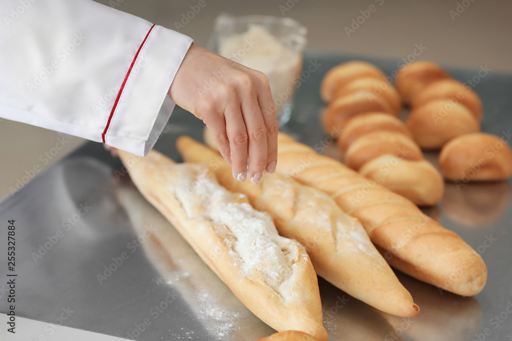 Female chef with freshly baked bakery products in kitchen Stock Photo ...