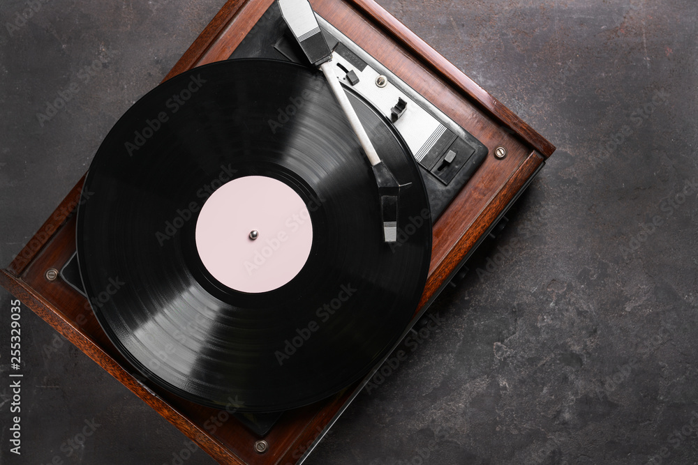 Record player with vinyl disc on grey background Stock Photo | Adobe Stock