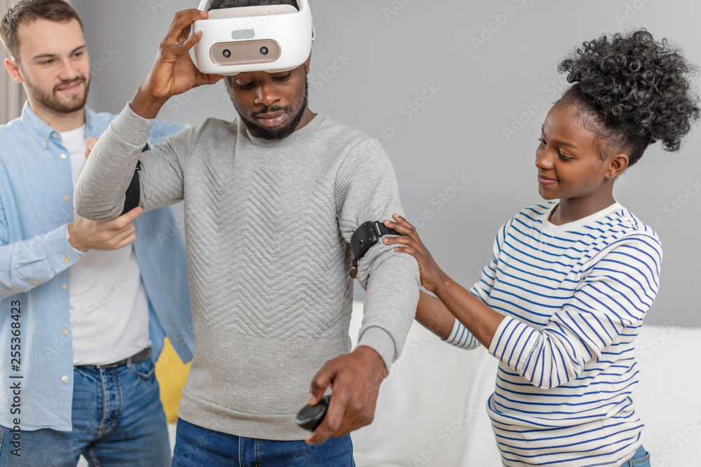 Professional caucasian gamer gives masterclass to african couple ...