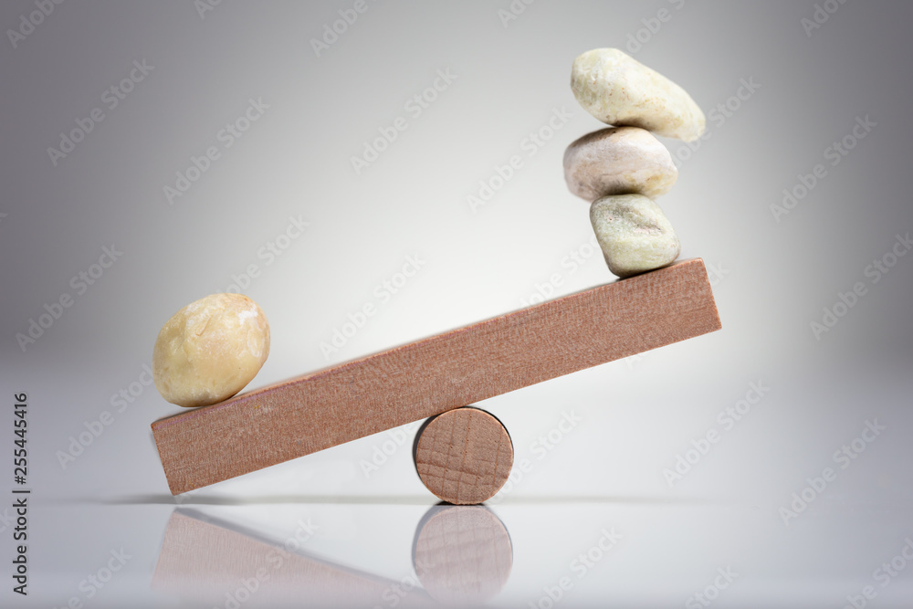 Pebble Stones Balancing On Seesaw Stock Photo | Adobe Stock
