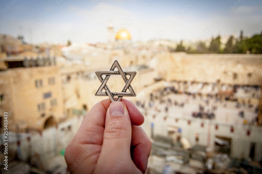 JERUSALEM, ISRAEL. February 15, 2019. Hand holding a Star of David, a ...