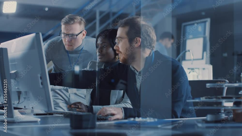 Two Electronics Development Engineers Working on Computers, Talk with ...