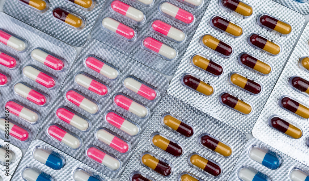 Top view of colorful antibiotic capsule pills in blister pack ...