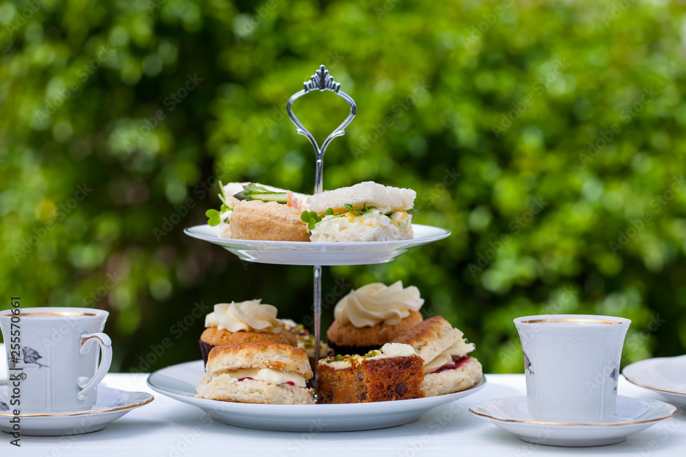 Afternoon tea with sandwiches and cakes Stock Photo | Adobe Stock