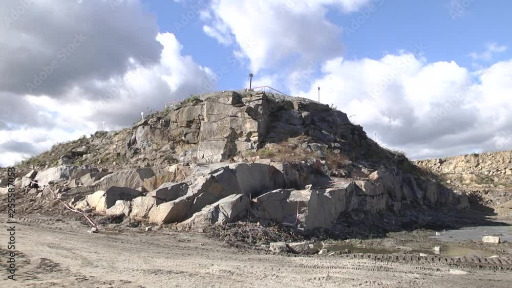 Mining industry. View into a quarry mine for porphyry rocks. factory ...