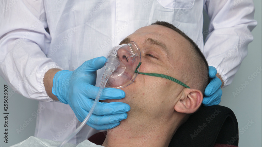 In the clinic (hospital), the Doctor (doctor's assistant) puts on an ...