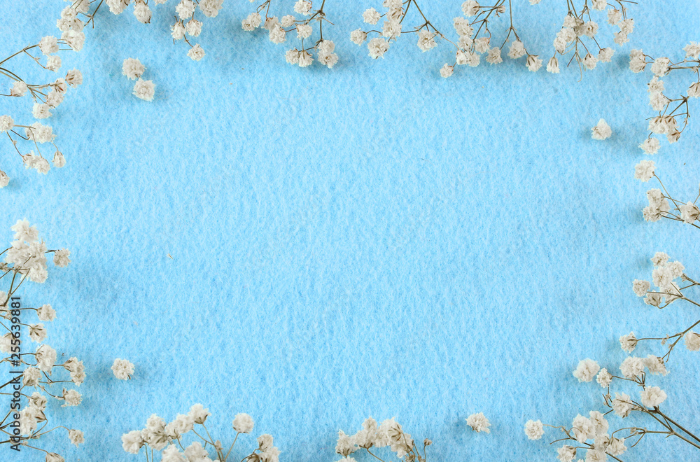 Blue felt background and babies breath border with copy space. Great ...
