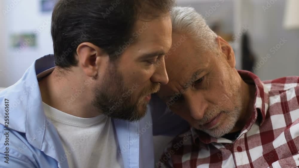 Vidéo Stock Caring son supporting his ill and depressed father telling ...