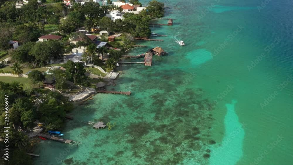 Aerial view of resorts lining shore of lake Bacalar the lagoon of seven ...
