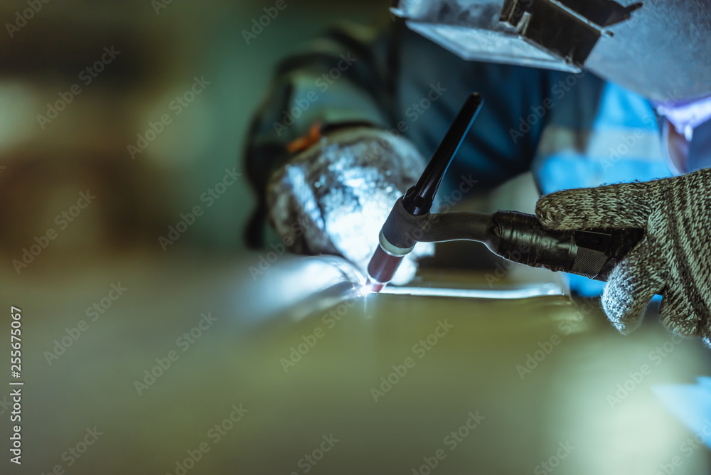 Industrial welder welding stainless piping presure vessel part ...