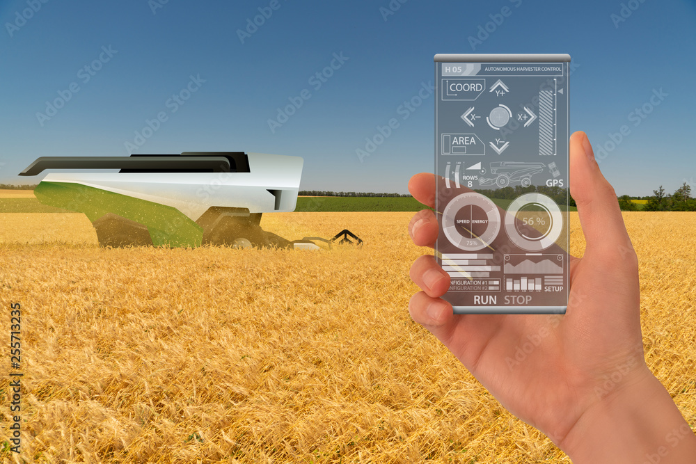 Farmer uses a futuristic smartphone to control autonomous harvester ...