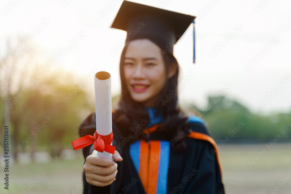 Female university graduate celebrates graduation ceremony receiving ...