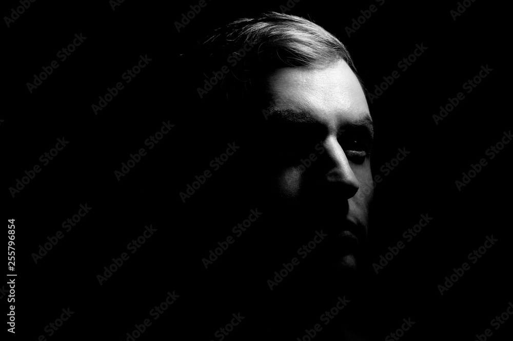Dramatic portrait of a guy on a black background, black and white ... Dramatic portrait of a guy on a black background, black and white ...