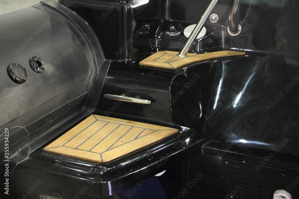 Swimming platform with teak cover on the transom black RIB motor boat ...