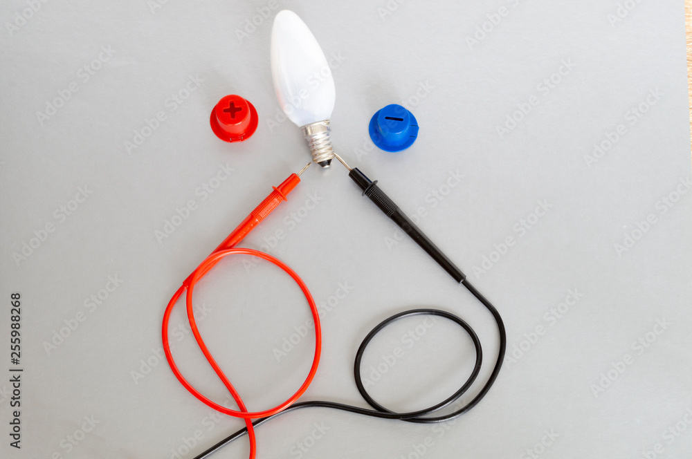 the red and black probes of the multimeter and the signs of polarity of ...