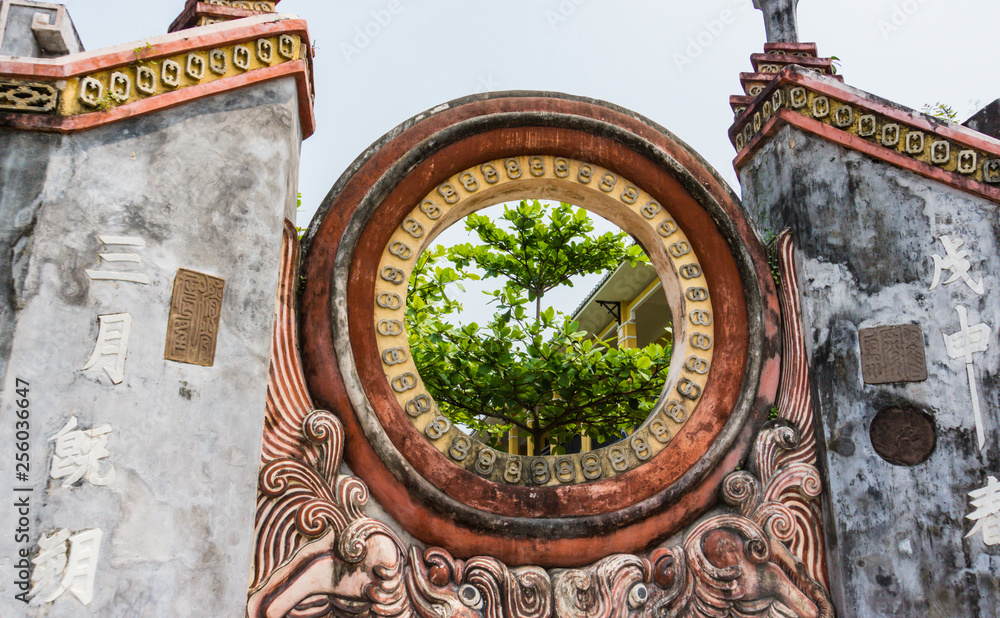 open circle on the Ba Mu Temple Gate in historic old town of Hoi An ...