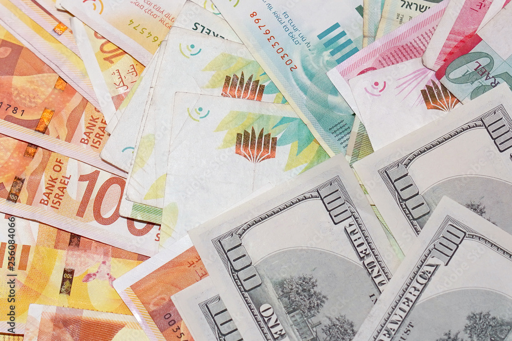 stack of the new Israeli money bills (banknotes) and money american ...