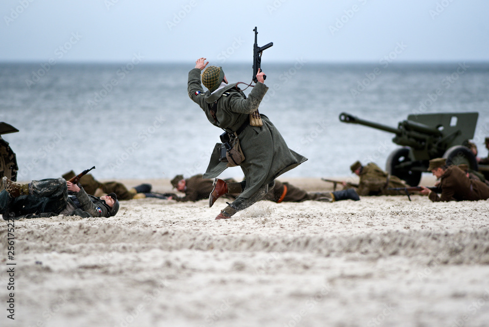 Soldiers fighting on the beach during the reconstruction of the ...