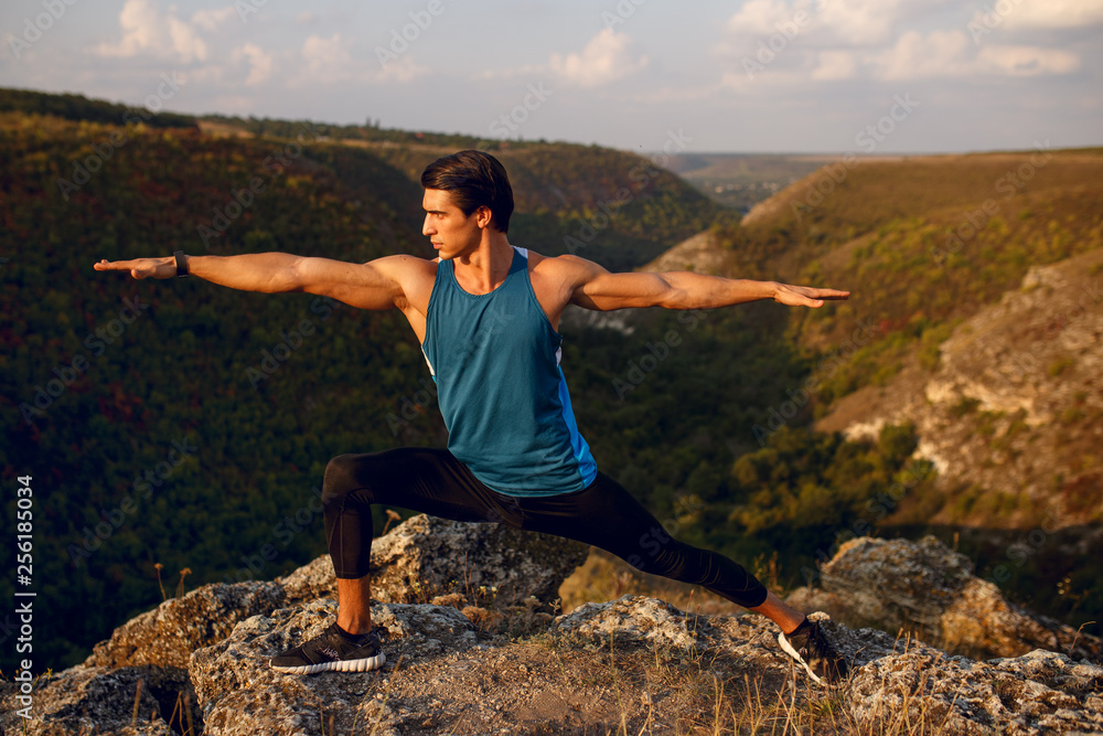 Athlete, muscular, fit, abs, young man doing stretching exercises ...
