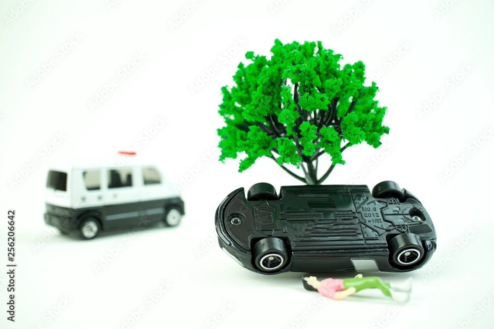 Isolated close up car accident scene. Car crash on a tree and flip over ...