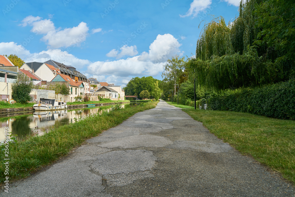 Empty path beside canal in Amiens, France Stock Photo | Adobe Stock
