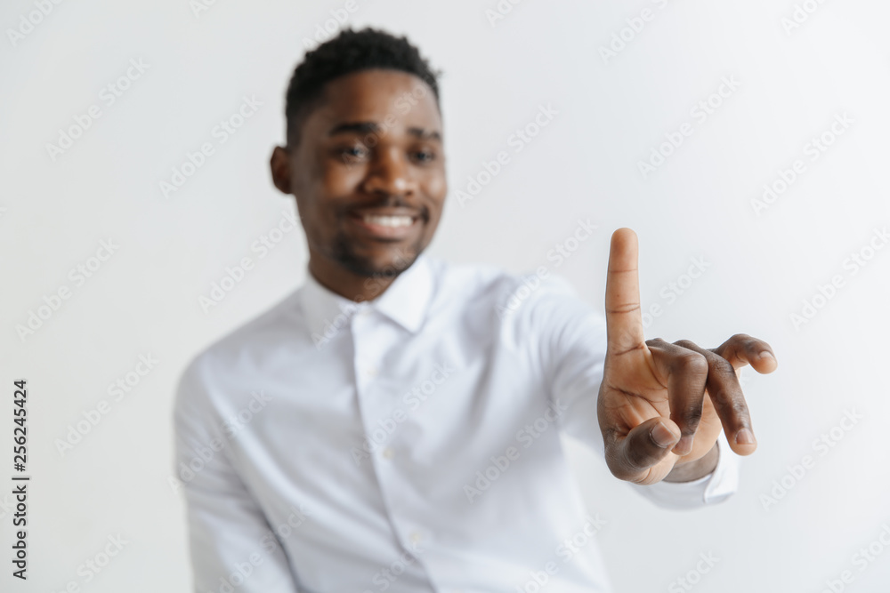 Handsome businessman pointing his finger to the camera and slicking ...