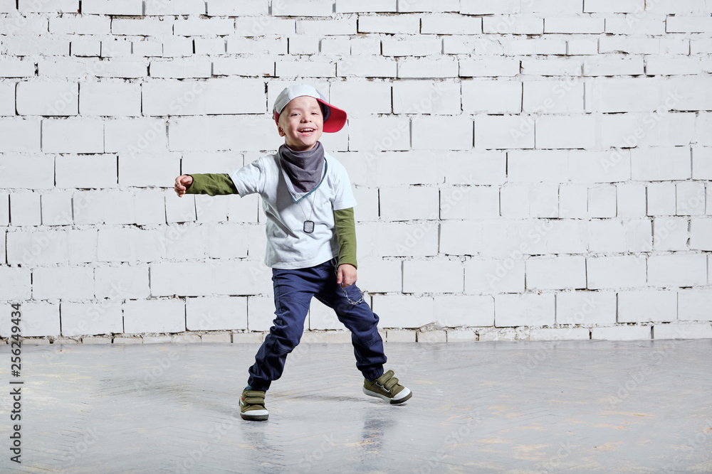 cheerful child boy dancing to music. Cool boy hip hop. Cute fashionable ...