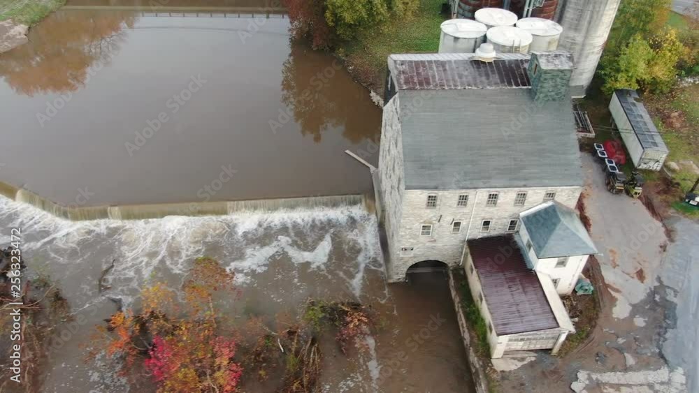 Aerial pan from Conestoga River dam spillway to colonial limestone ...