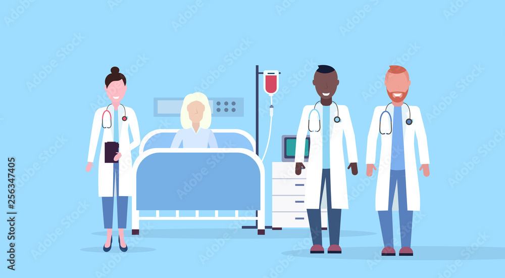 mix race doctors team visiting patient senior woman lying bed intensive ...