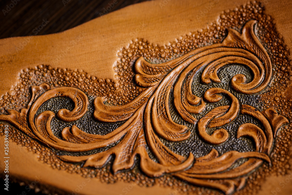 embossed pattern on the leather in the workshop Stock Photo | Adobe Stock