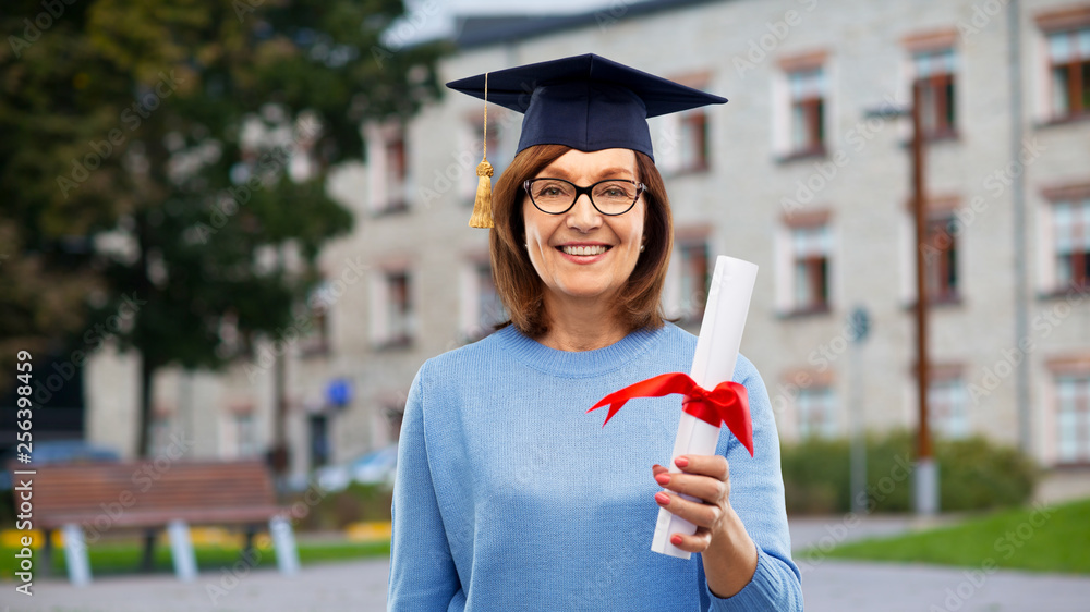 graduation, education and old people concept - happy senior graduate ...