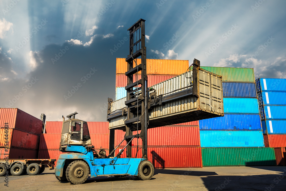 Forklift container loading and unloading cargo into the import-export ...