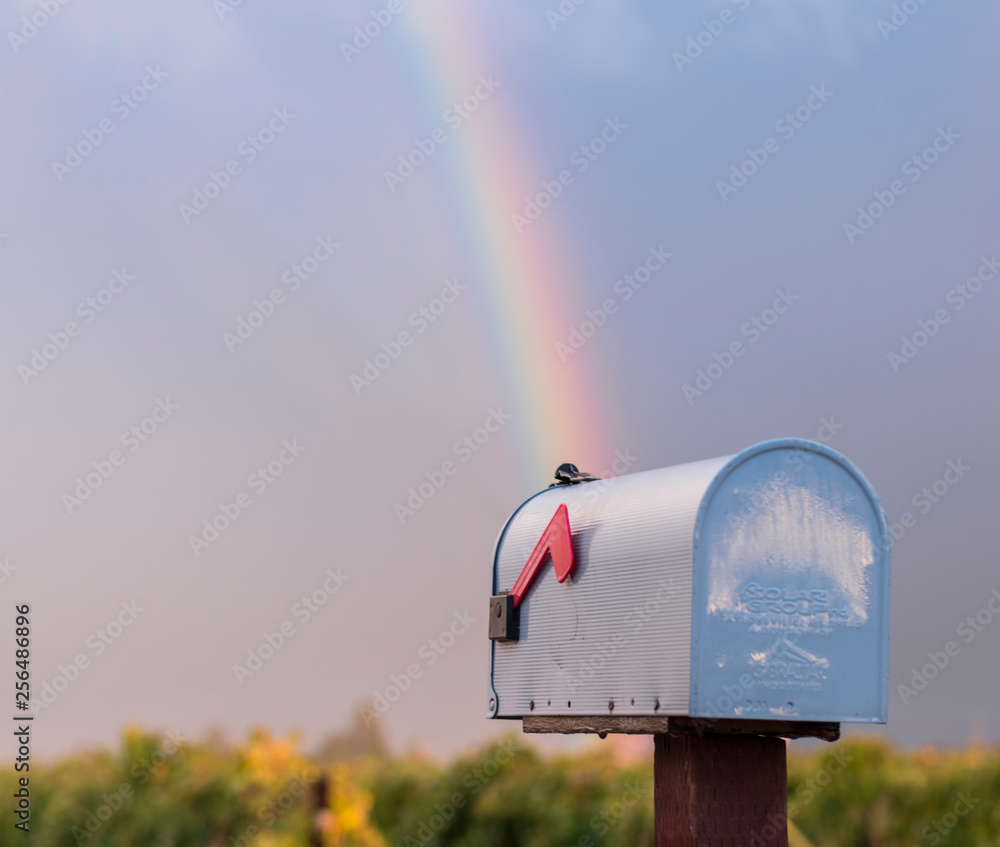 Rainbow falling from sky into mailbox on rainy day Stock Photo | Adobe ...