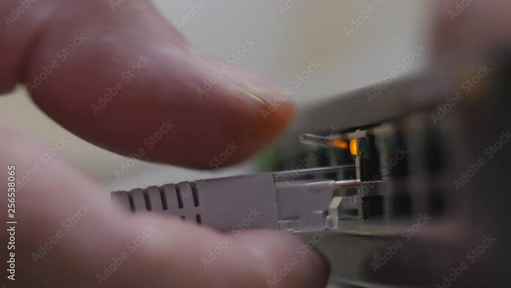 Male Hand Take Out White Data Cable From The Gigabit Network Switch ...