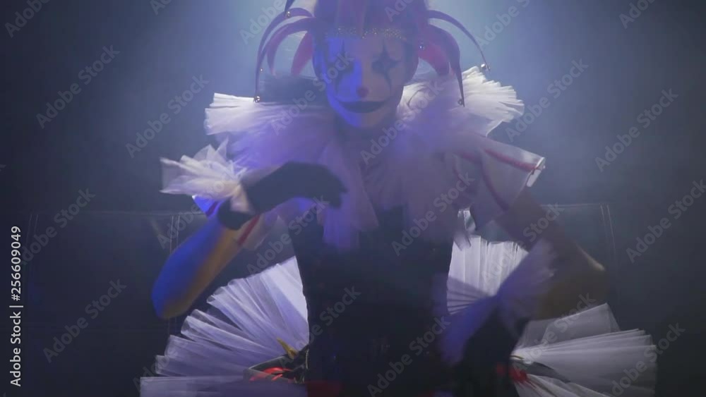 Horror circus with a creepy clown woman with white annd black makeup ...