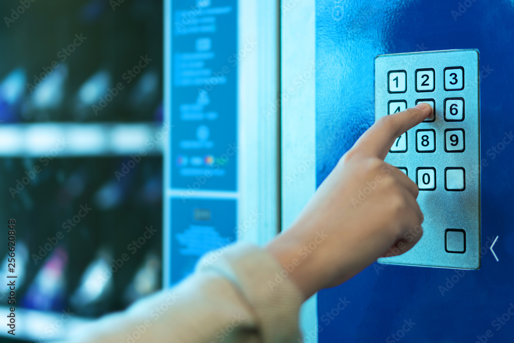 Finger pushing number button on vending machine Stock Photo | Adobe Stock