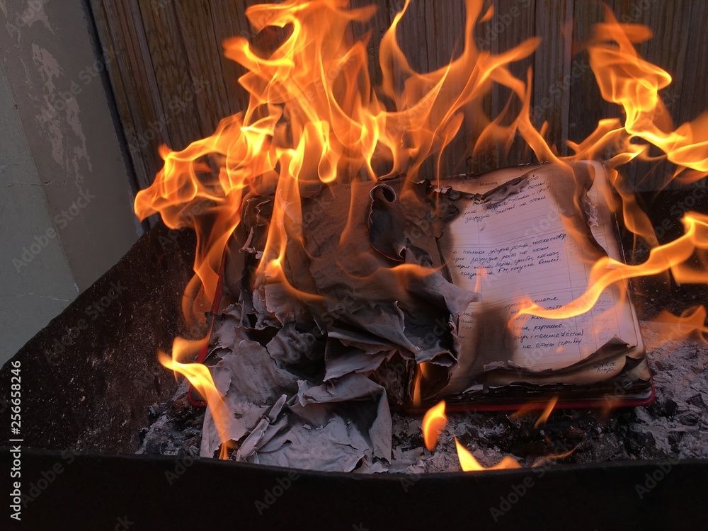 School diary with daily hand written note burning in fire flame Stock ...