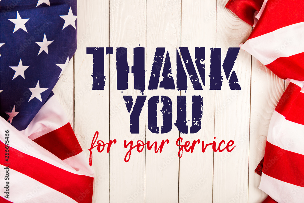 Top view of American flags and thank you for your service lettering on ...