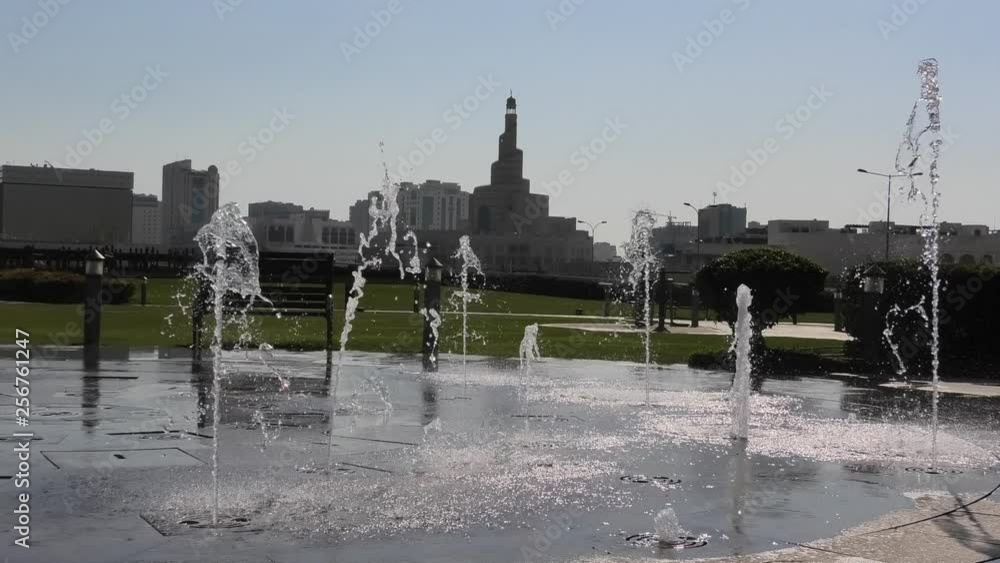 Colorful water fountain at Souq Waqif Park at Doha Corniche with Fanar ...