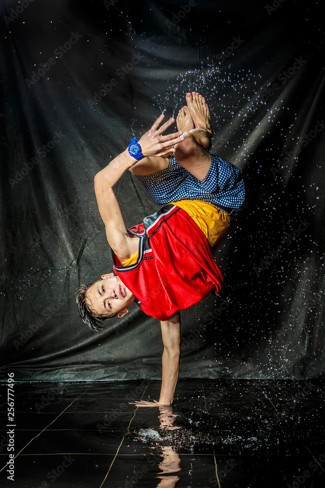 cool and happy korean young guy break dancer in style of bboying doing ...