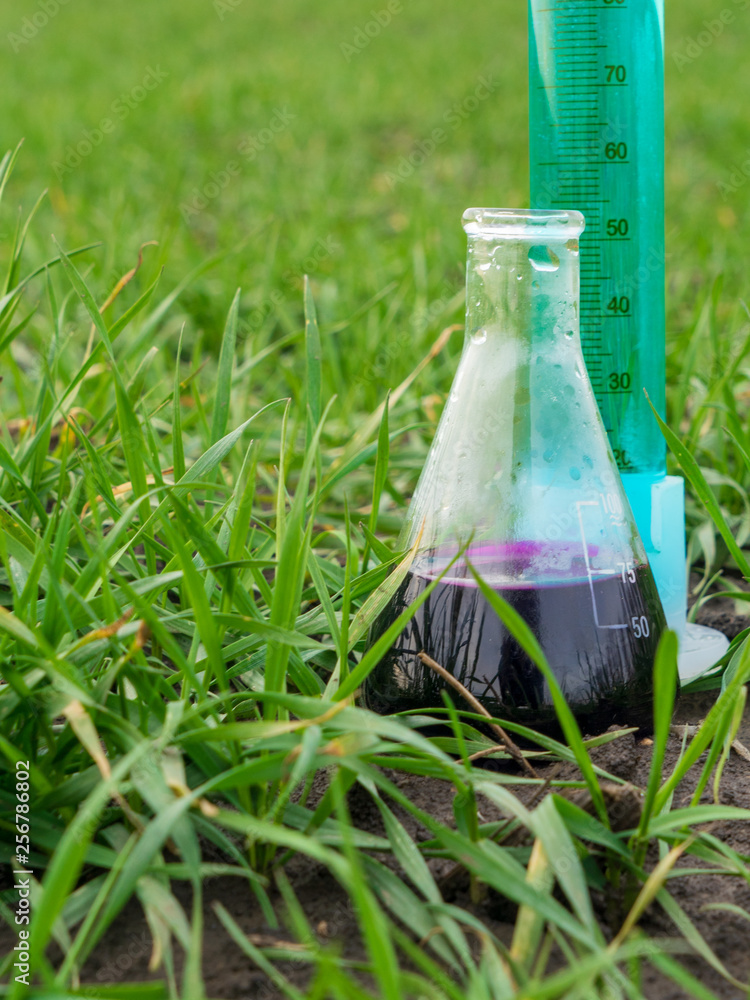 Image of a glass flask with a chemical solution on the background of ...