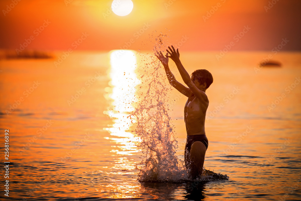 boy on the beach Stock Photo | Adobe Stock