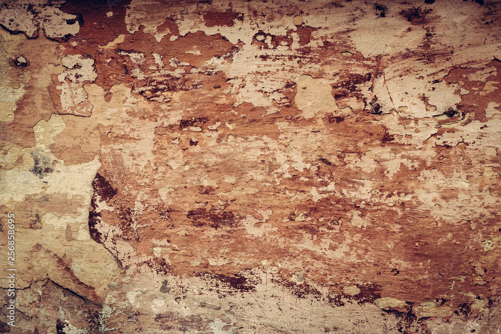 Shabby plaster maroon and orange of wall background. Exterior detail ...